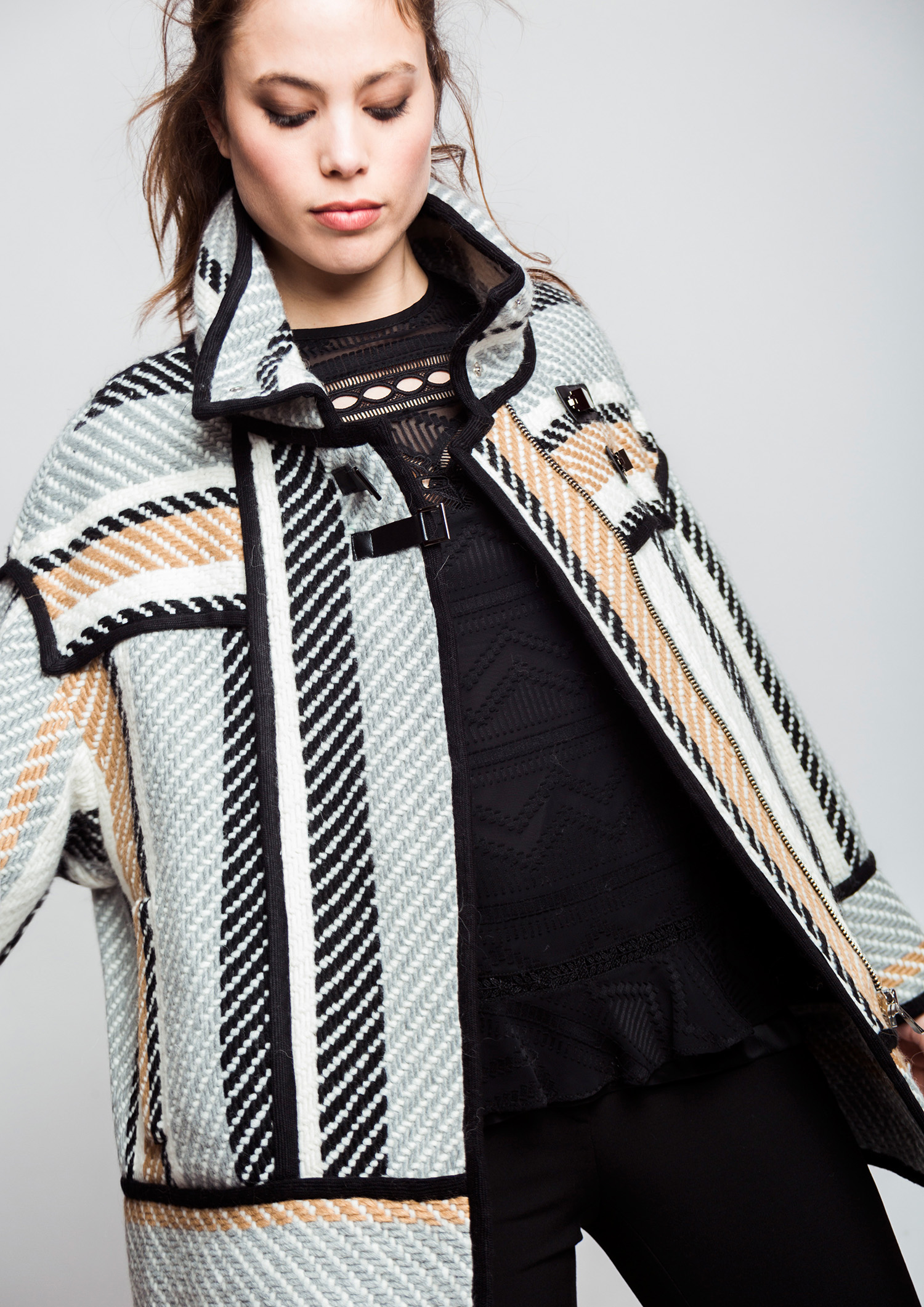 Striped jacket with black piping.