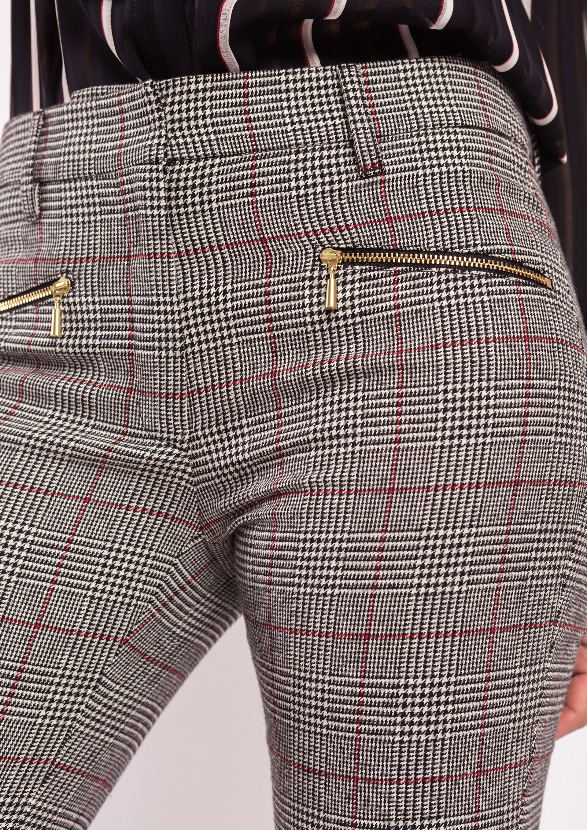 Checked trousers with zips